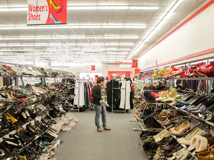 Mountains of shoes await, each pair with its own story and surprisingly intact soles.