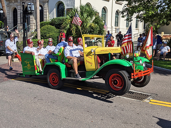 Nothing says "we take fun seriously" like grown men in fezzes driving a vintage vehicle during the Shrimp Festival Parade. Local celebration at its finest!