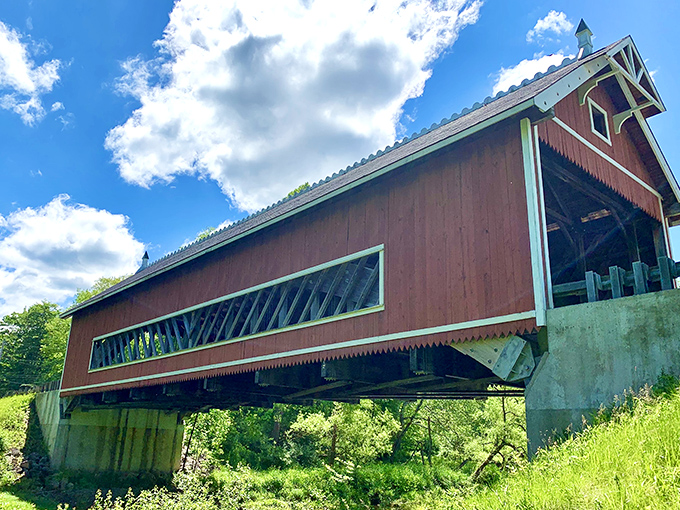 From this angle, you can appreciate the bridge's sturdy construction and the way sunlight plays across its weathered siding.