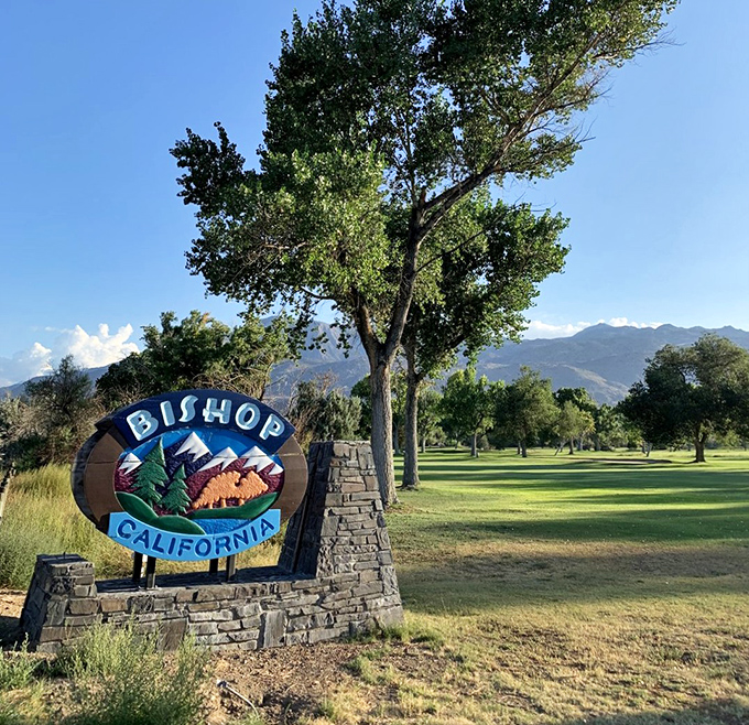 Bishop's welcome sign stands sentinel against a backdrop of green space and mountains&mdash;nature's version of the perfect photo frame.