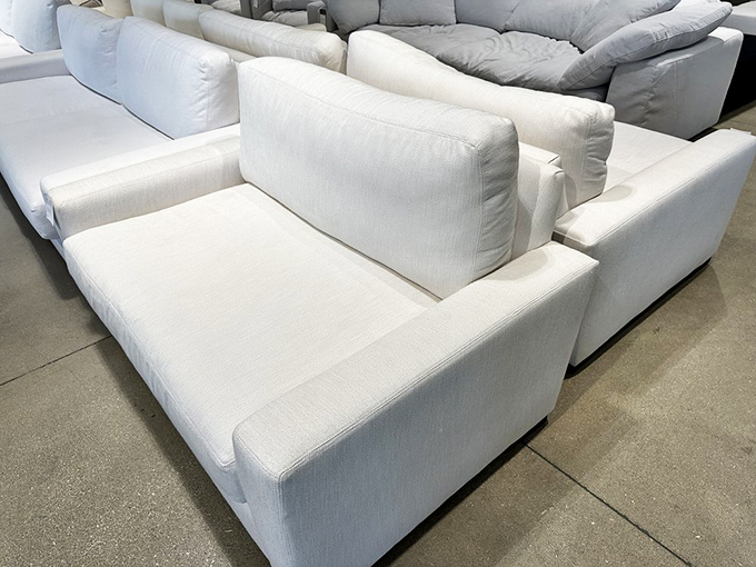 These pristine white sofas aren't just for show&mdash;they're strategically placed relationship savers for weary shopping companions who've hit their retail limit.