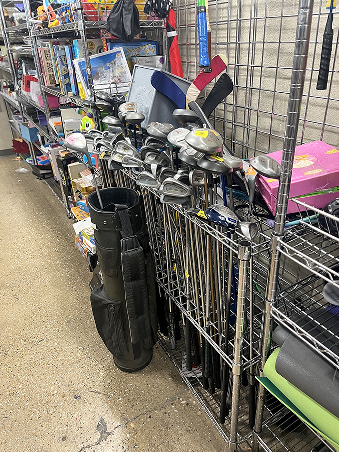 Golf clubs huddle together like old teammates, each with stories of perfect drives and spectacular slices, waiting for their next round.