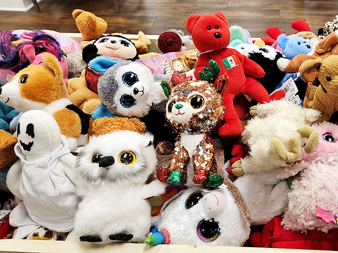 These plush companions are having their own little convention, just waiting for someone to take them home. The sequined cat is clearly the chairman.