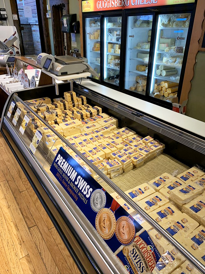 Behold the motherlode&mdash;blocks of award-winning Swiss cheese lined up like gold bars in Fort Knox, each one a testament to dairy perfection.