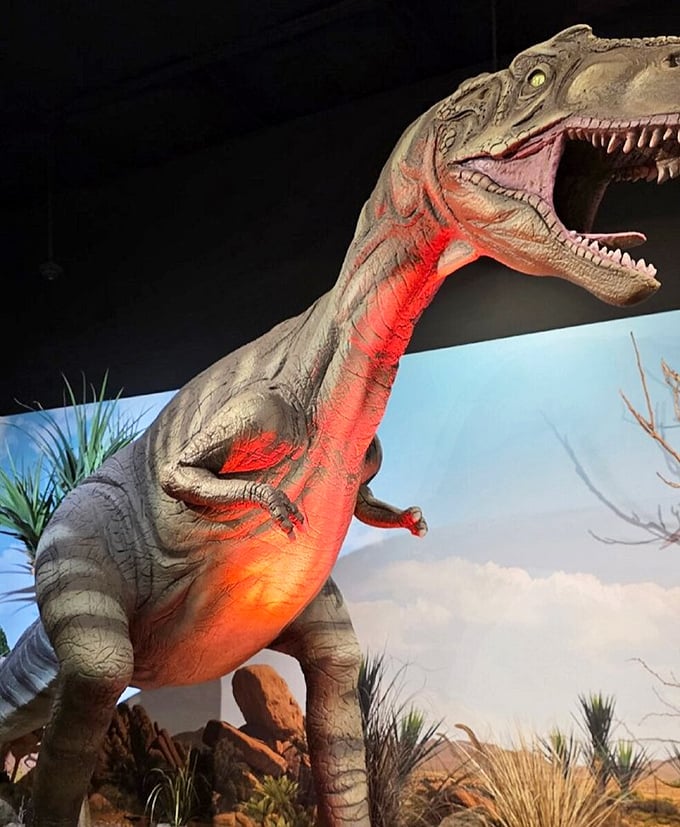 This T-Rex greets visitors with a toothy grin and dramatic lighting. Jurassic Park meets Vegas showbiz in the Arizona desert.