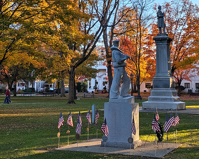 Fall transforms The Green into nature's art gallery, where Civil War monuments stand sentinel among trees dressed in their autumn best.