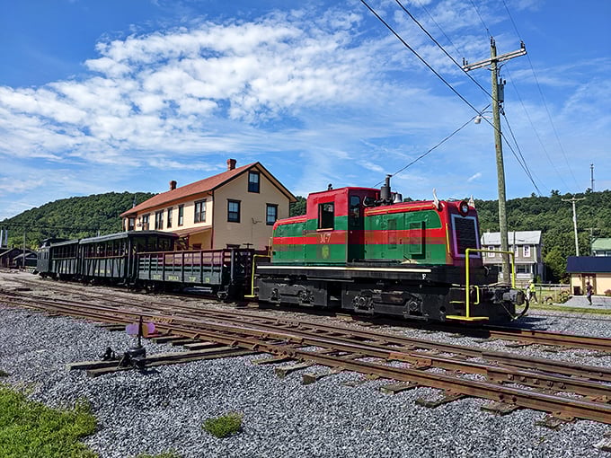 The Christmas-colored M-7 diesel switcher proves not all power needs steam. Like finding an unexpected vintage muscle car among classic roadsters.