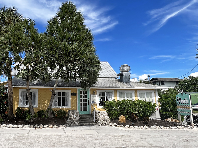 The Porch Restaurant's sunny yellow facade is like Florida sunshine in architectural form &ndash; inviting you in for a taste of island life.
