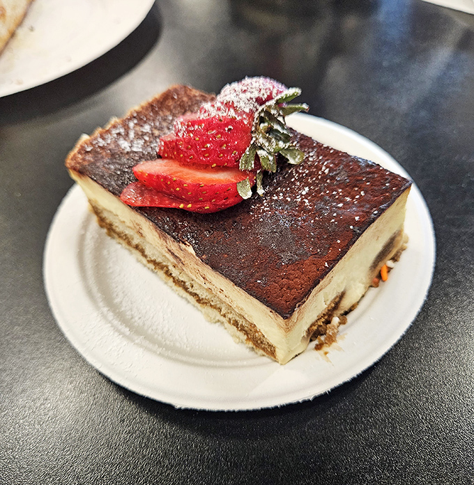 This tiramisu isn't just dessert, it's an edible masterpiece. That strawberry on top isn't garnish&mdash;it's the crown jewel of a flavor kingdom.