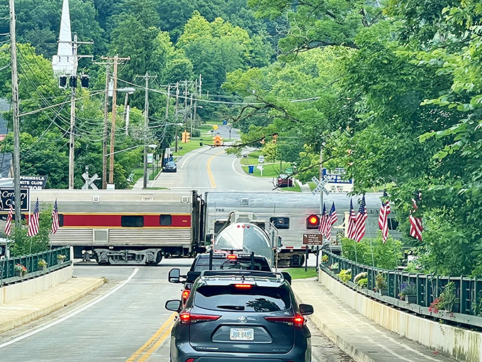 The quintessential Peninsula moment: waiting for the historic train to pass, a brief pause that somehow feels like stepping into a simpler, more charming era.