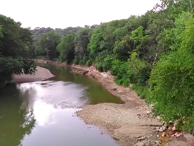 The Vermilion River curves gently through the landscape, a serene counterpoint to the dramatic canyons nearby. Nature's own mood swing.
