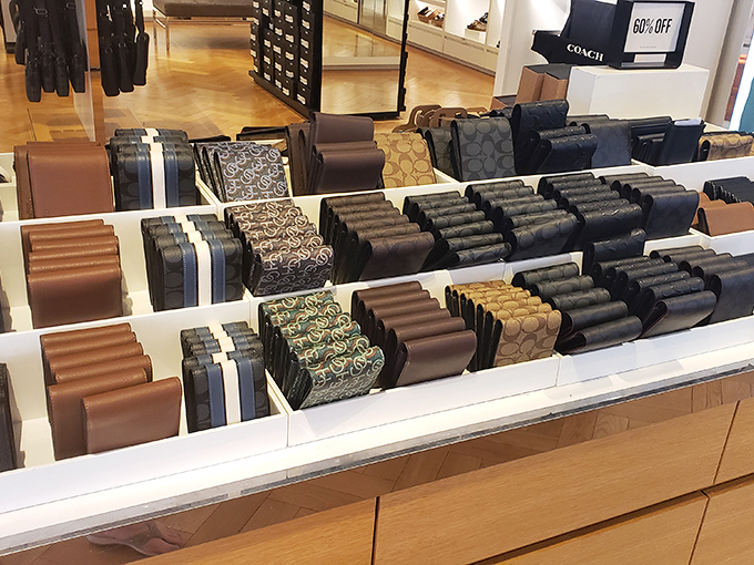 Coach wallets arranged with military precision&mdash;a leather goods battalion ready to march into your life and organize those crumpled receipts from your shopping conquests.