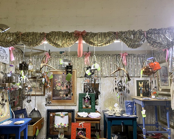 This booth's shimmering curtains and colorful frames create a time portal to grandma's house, where everything sparkled with possibility.