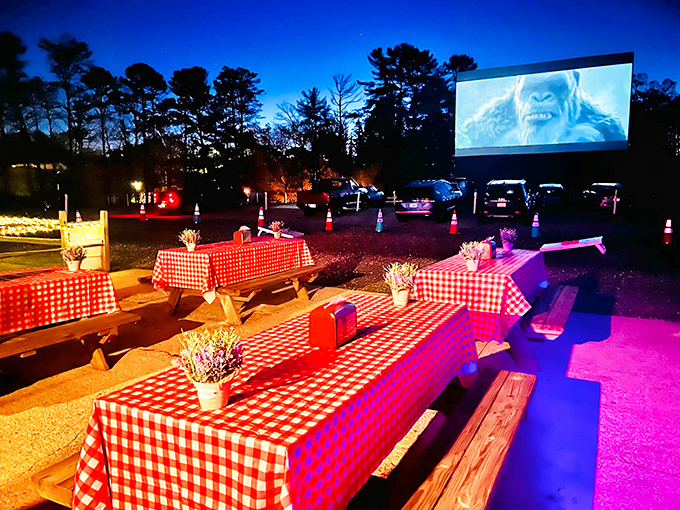 Classic red-checkered tablecloths under the stars&mdash;because nothing enhances a monster movie like dining al fresco with strangers who'll soon become friends.
