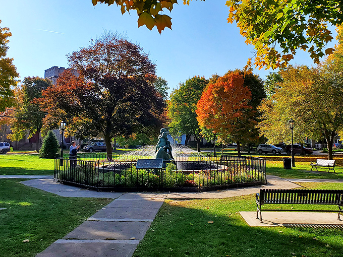 The Green's fountain provides a peaceful centerpiece where autumn leaves compete with architecture for who can show off more.