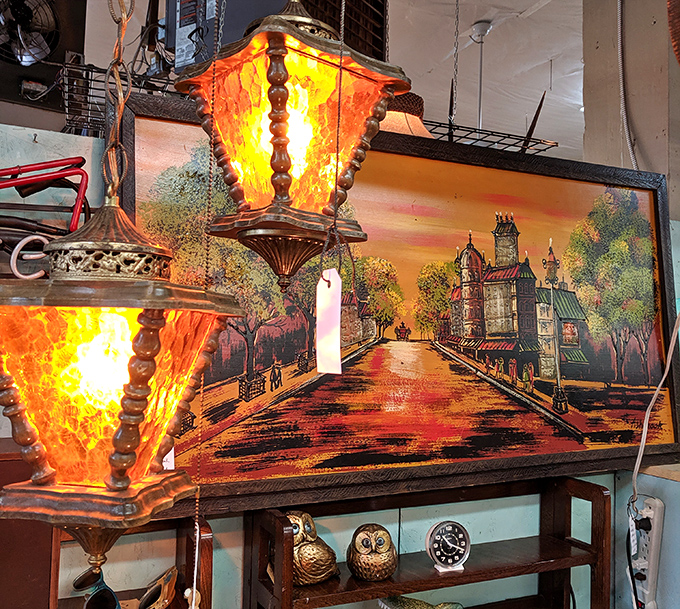Vintage lamps cast an amber glow over nostalgic artwork, creating the perfect vignette of bygone eras. Time travel, illuminated.