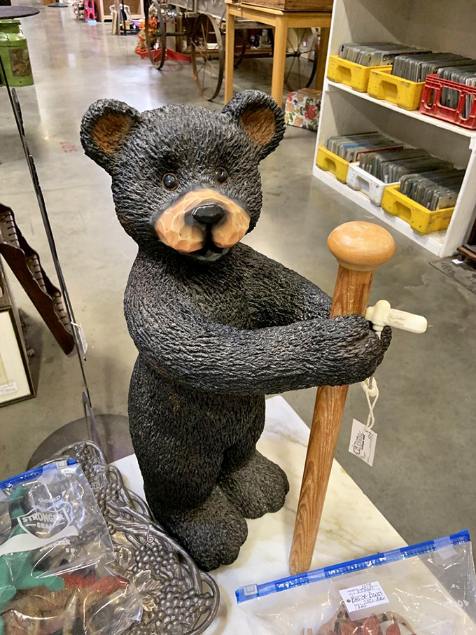 "I've been waiting for you," this vintage bear seems to say, ready to guard your garden or welcome guests.