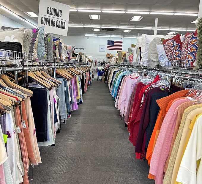 Not just rows of clothing&mdash;these are corridors of possibility, where yesterday's fashion finds tomorrow's admirers. Note the bilingual signage welcoming all bargain hunters.