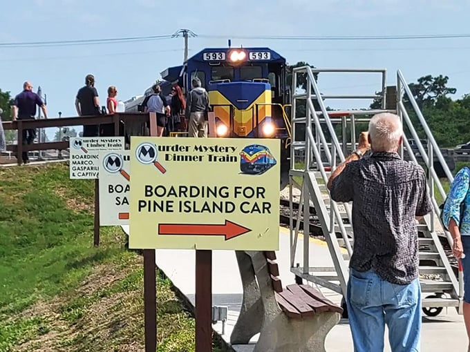"All aboard for murder!" The boarding sign promises mystery and intrigue, turning ordinary passengers into amateur sleuths for the evening.