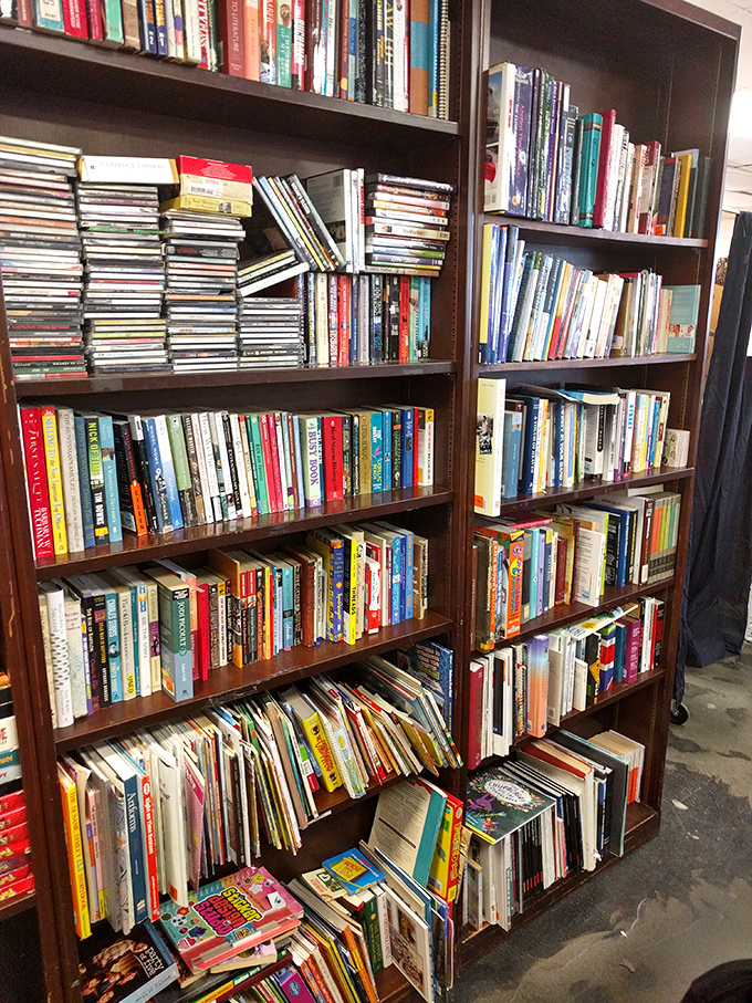A bibliophile's dream come true! These shelves hold more stories than just the ones printed on their pages. Each book awaits its second chance at being loved.