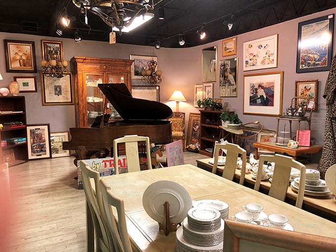 A grand piano anchors this elegant furniture display, proving "secondhand" and "sophisticated" aren't mutually exclusive terms.