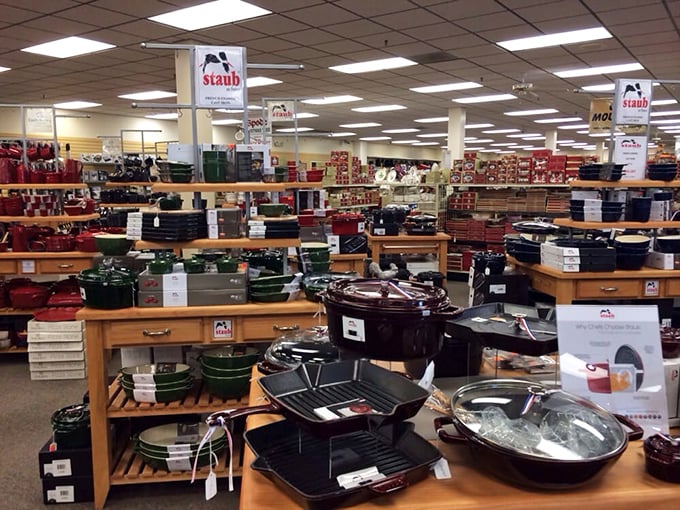 Staub cookware stretches across the showroom like a rainbow made of cast iron and culinary possibilities galore.