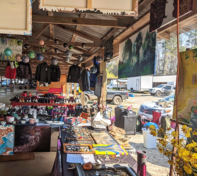 Every vendor space tells a different tale: vintage clothing hangs above handcrafted trinkets while paintings lean casually against decades of collected curiosities.