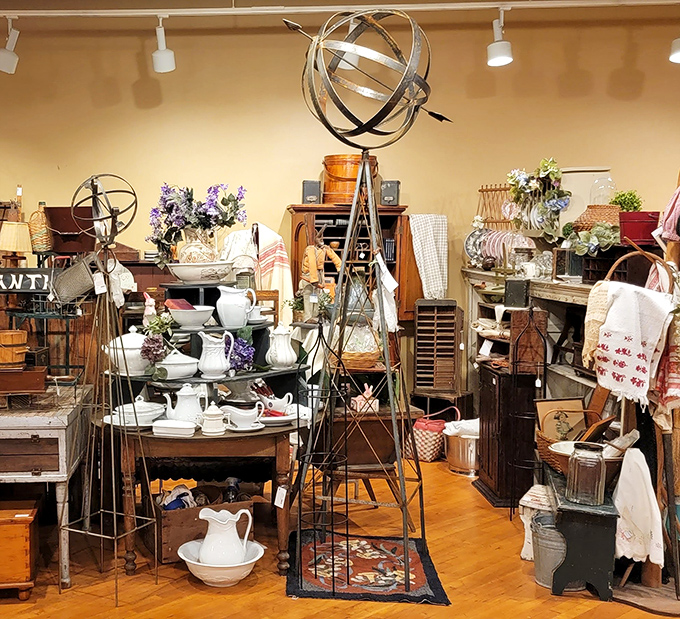 White pitchers and metal garden sculptures create an elegant vignette. Like a well-composed still life painting you can actually shop from.