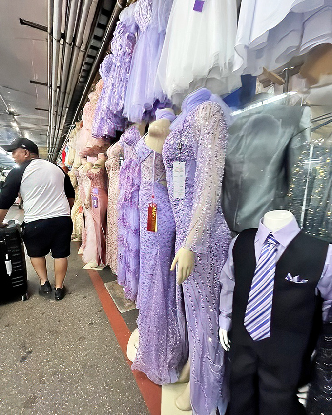 A rainbow of formal wear awaits its next special occasion. That lavender number is practically begging for a dance floor!