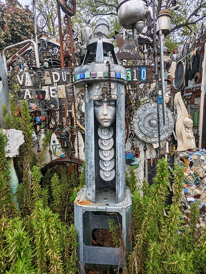 Part goddess, part machine, this haunting face emerges from industrial elements like Botticelli's Venus rising from a scrapyard sea.