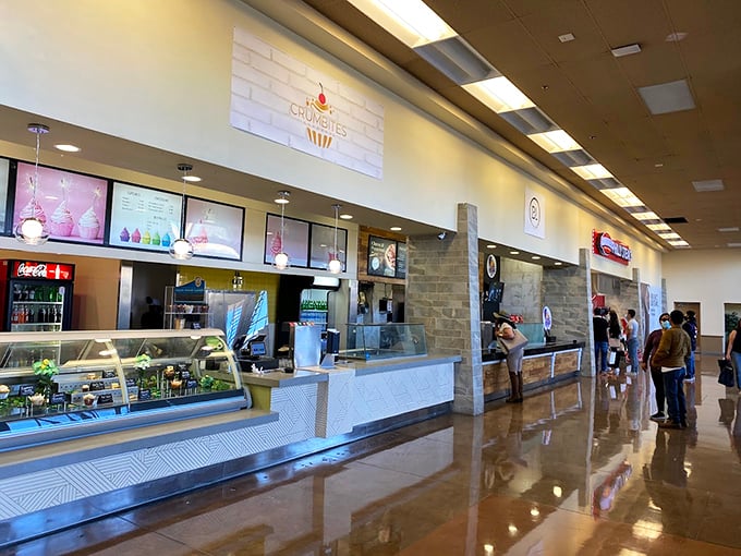 The food court gleams with possibility, offering a culinary pit stop for shoppers whose stomachs are as empty as their shopping bags are full.