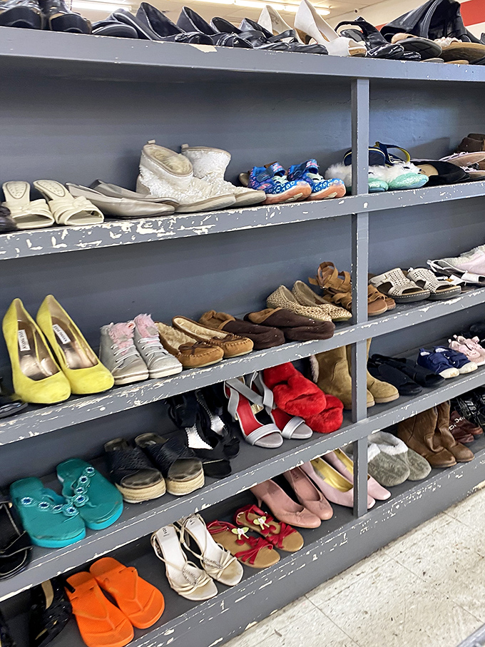 The shoe section resembles a footwear United Nations, where practical flats peacefully coexist with statement heels and vintage boots.