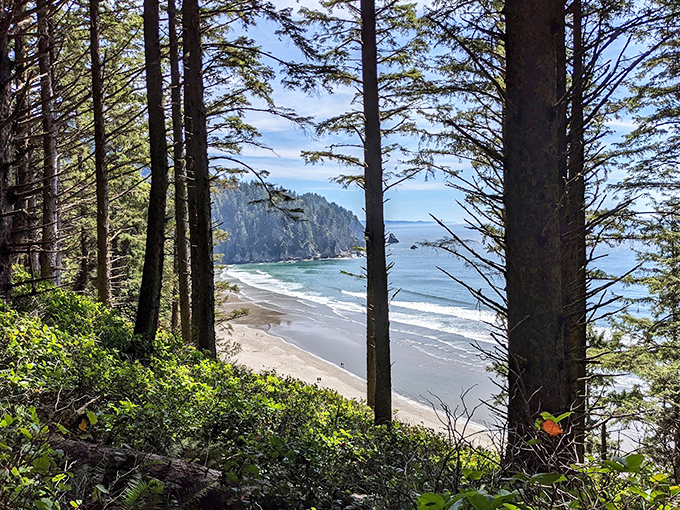 The reward at the end of the trail: Peek through nature's window frames to discover Short Sand Beach nestled between protective headlands.