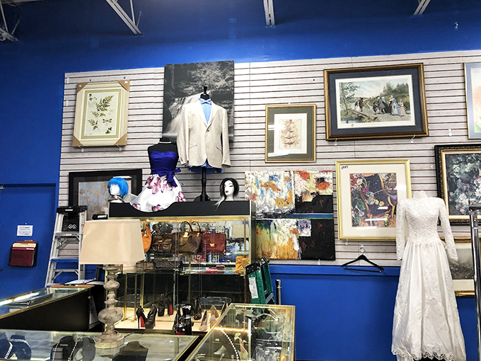 The formal wear section: where wedding dresses and blazers get their second chance at romance, all against that signature blue wall.