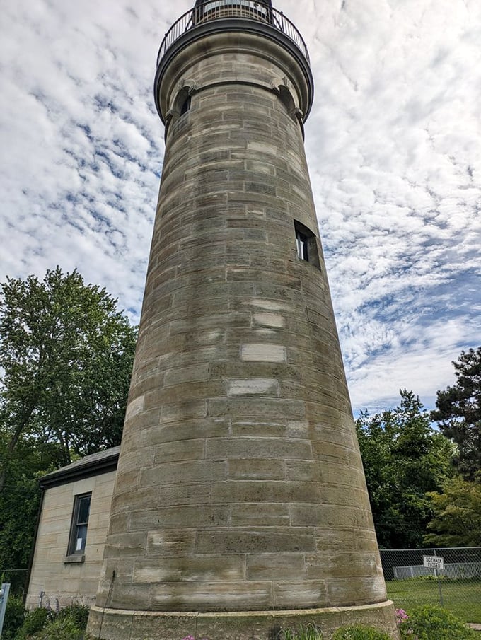 Against a dramatic sky, the lighthouse shows off its perfect proportions. If buildings could win beauty pageants, this one would have a crown.