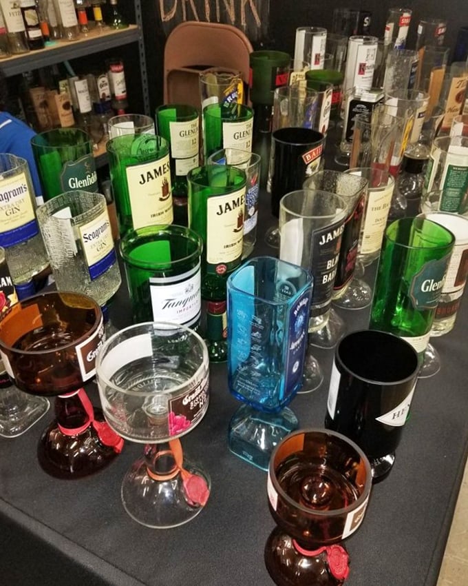 Upcycled liquor bottles transformed into colorful drinking glasses&mdash;proof that one person's recycling is another's dining room conversation piece.