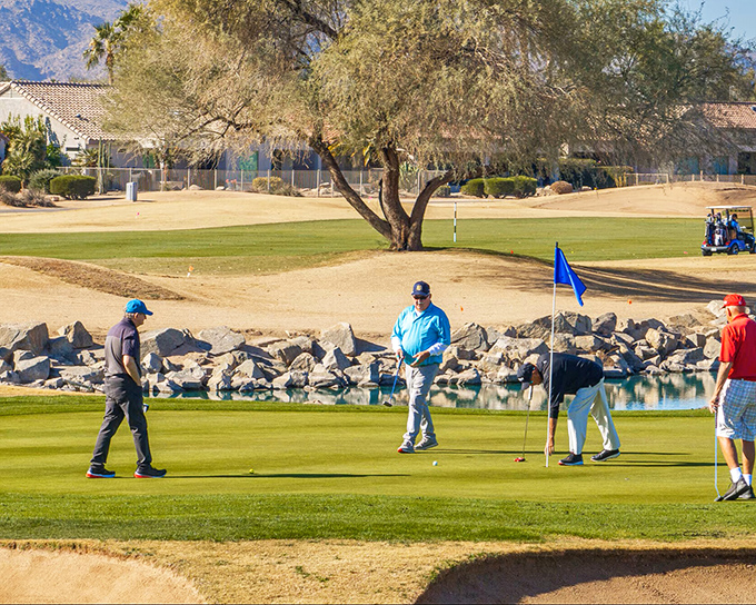 "Office meeting" takes on a whole new meaning here. Retirees discuss important matters like perfect putts and optimal tee times on meticulously maintained greens.