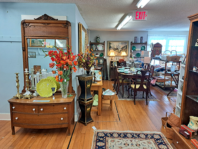 A vignette that tells stories of Charleston homes past &ndash; antique dressers, fresh flowers, and carefully arranged treasures await their next chapter.