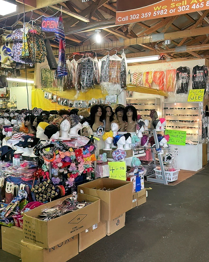 A fashion wonderland where mannequin heads silently model possibilities and cardboard boxes hold who-knows-what waiting to be discovered.