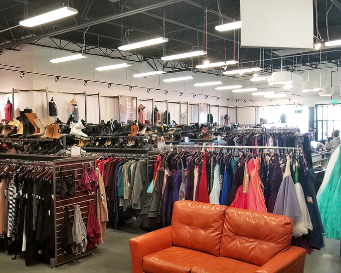 Orange couches provide strategic resting spots for the overwhelmed or the patient shopping companion. Fashion hunting requires occasional breaks!