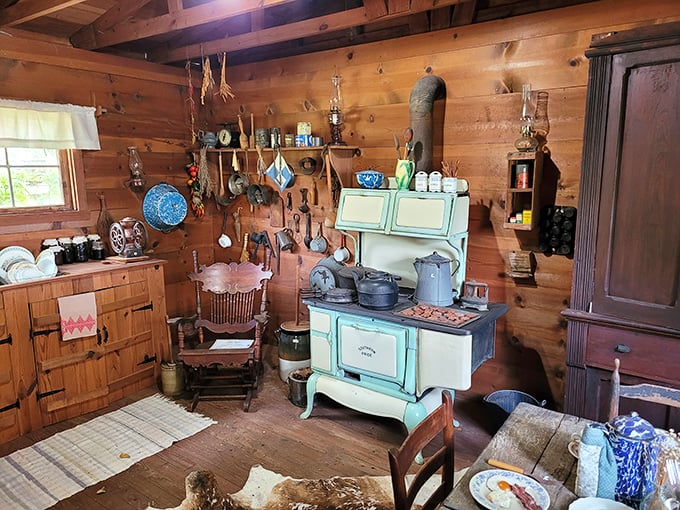 The pioneer kitchen: where "quick meal prep" meant only spending three hours instead of four. That mint-green wood stove has stories to tell!