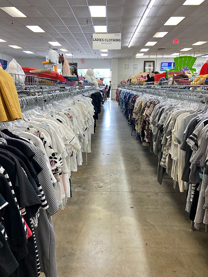 The ladies' clothing section: where patience and persistence transform into fashion gold. White blouses on the left, life stories on the right.