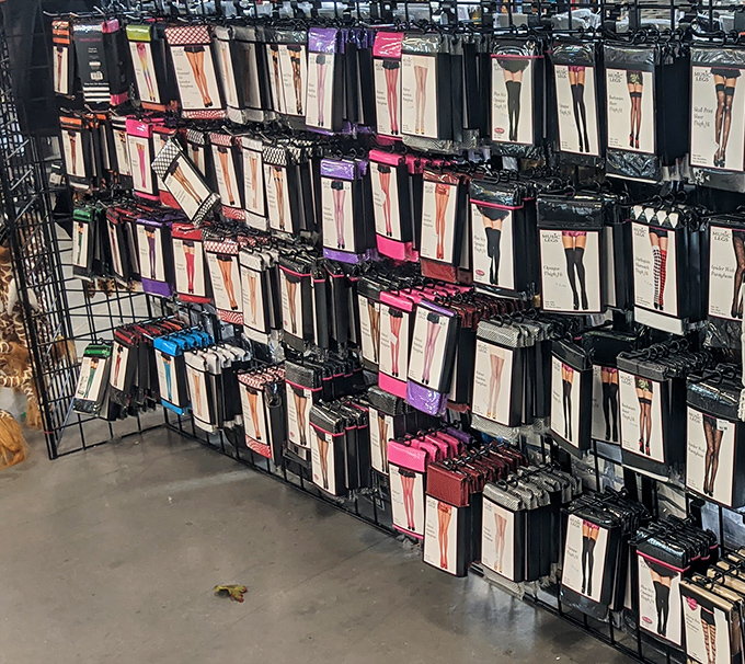 An entire wall dedicated to packaged hosiery proves that even thrift stores understand Florida's complicated relationship with seasonal clothing.