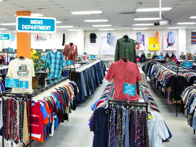 The men's department: where Hawaiian shirts and business attire coexist in perfect harmony, like a mullet's philosophy of business in front, party in back.