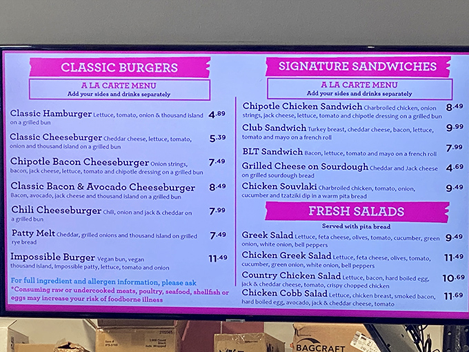 The menu reads like a love letter to American classics. Pink panels frame comfort food favorites that have survived every food trend for good reason.