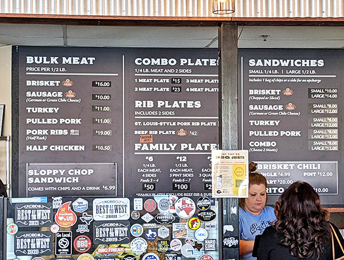 The menu board&mdash;a sacred text for carnivores&mdash;promises smoky salvation in the form of ribs, brisket, and sausage.