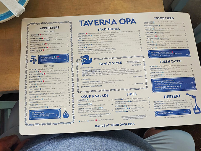 The menu reads like a love letter to Greek cuisine, with "Dance at Your Own Risk" printed at the bottom&mdash;a warning that proves deliciously prophetic as the evening unfolds.