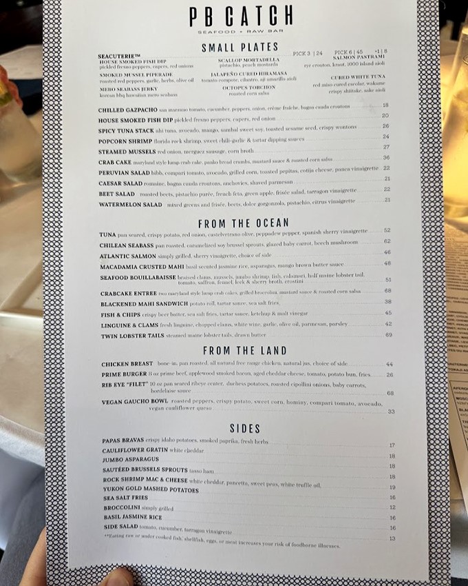 A menu that reads like love letters from the ocean. I've seen religious texts studied with less reverence than I give to these seafood selections.