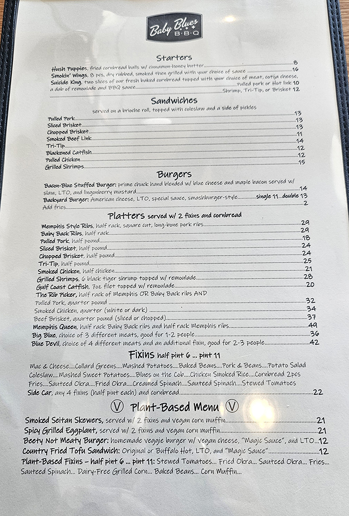 The menu reads like a love letter to American barbecue traditions—Memphis ribs, Texas brisket, and California tri-tip peacefully coexisting on one glorious page.