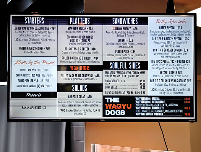 The menu board reads like a love letter to smoked proteins. Notice how "Smoked Chicken" gets top billing? That's no accident, folks.